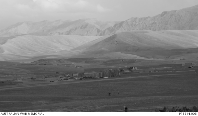 Mountainous landscape outside of the Multi-National base in Tarin Kot ...