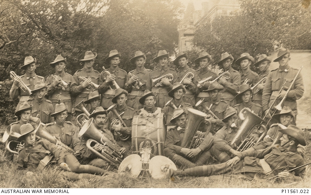 Group portrait of brass and drum battalion band. Note the bandleader on ...