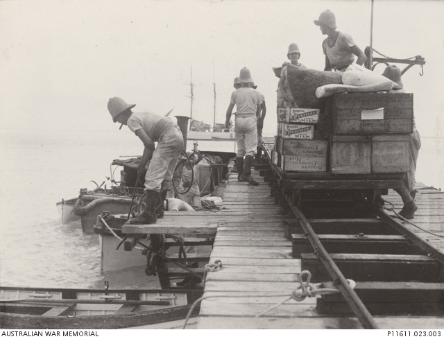 "Germans commandeering stores." (Album caption). From an album compiled ...