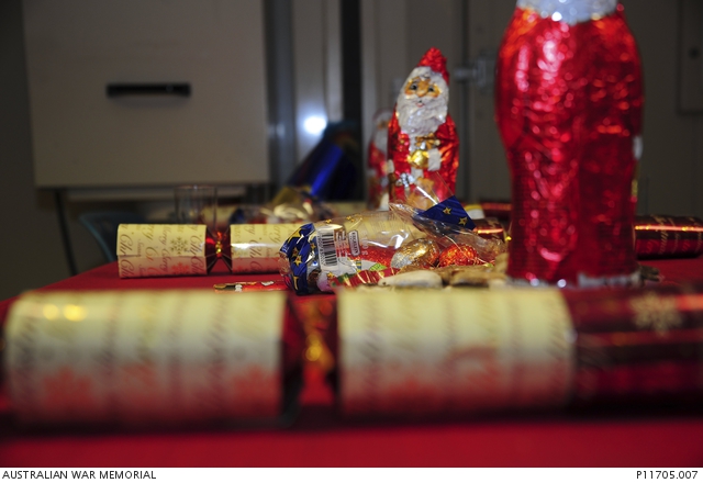Christmas bon bons and chocolates are set on the tables in the mess at ...