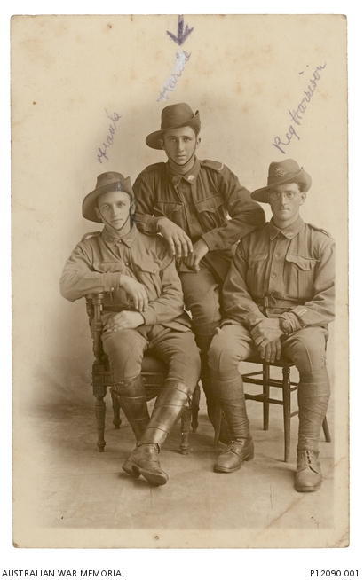 Studio group portrait of three Australian soldiers, from left to right ...