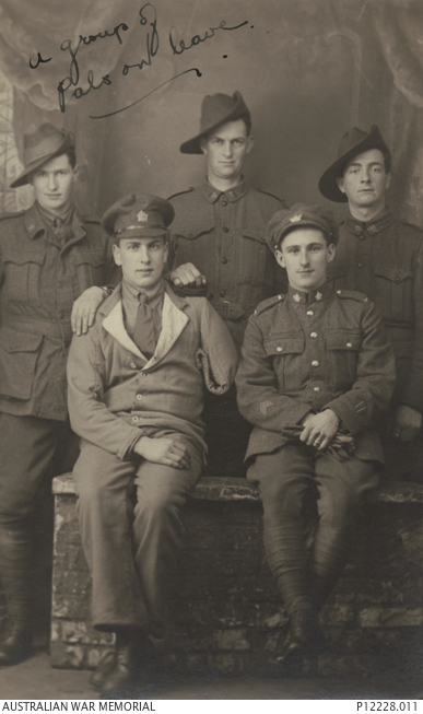Studio portrait of five unidentified soldiers. The photograph is ...