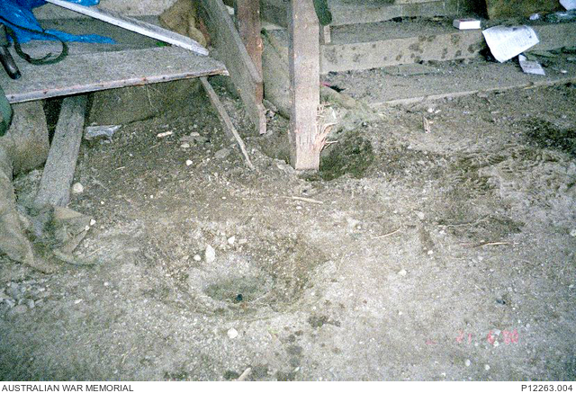 Grenade damage to a building resulting from an attack by pro-Indonesian ...