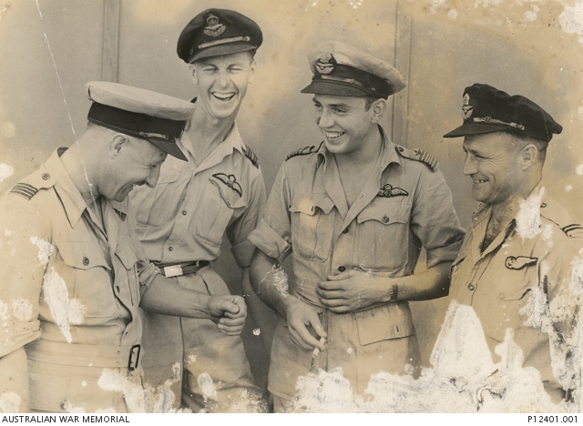 A group of four RAAF officers. The group includes two pilots (wings ...