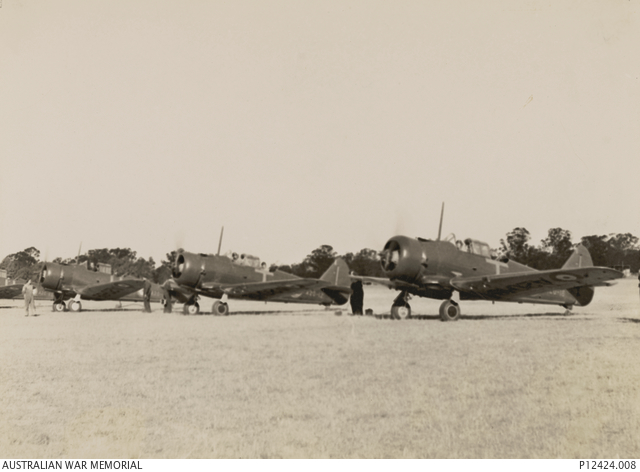 Three Wirraway aircraft from No. 23 Squadron RAAF line up, ready for ...