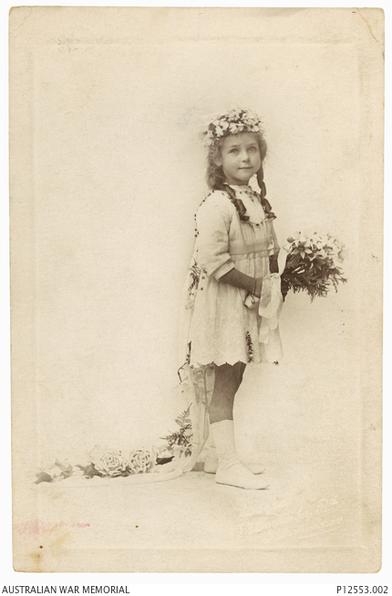 Studio portrait of Marjorie Cook (Madge) dressed as a May Queen. Madge ...