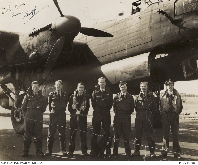 Group portrait of seven crew members of 156 Squadron in front of their ...