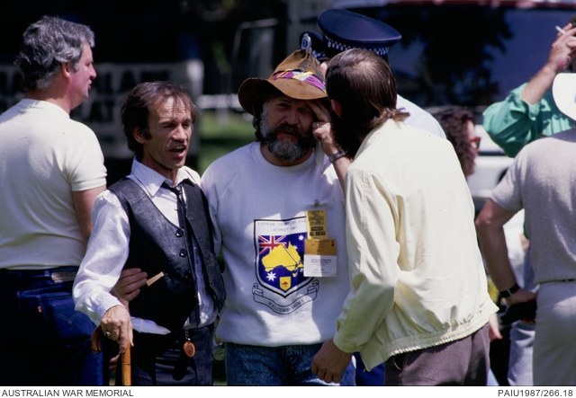 Normie Rowe speaks with unidentified veterans backstage at the Vietnam ...