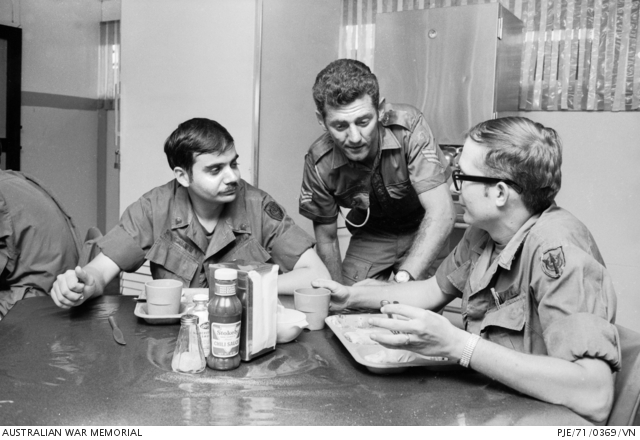 Sergeant (Sgt) Bob Randal of Puckapunyal, Vic (centre), a cook with the ...