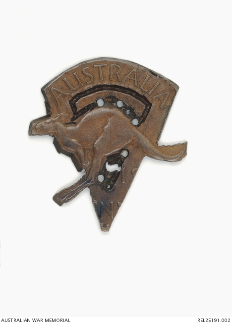 Partially completed victory badge made from an Australian penny ...