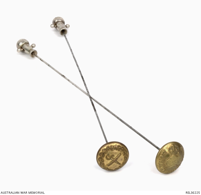 Pair of hat pins made from military buttons | Australian War Memorial