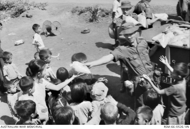 Vietnam. 1966-06-26. Rice bowls are held high by South Vietnamese ...