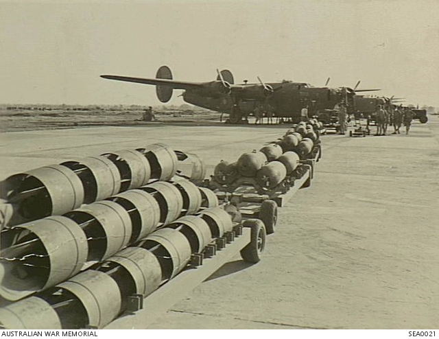 Digri, Bengal, India. 1944-11-27. Bomb trolleys being wheeled out to ...