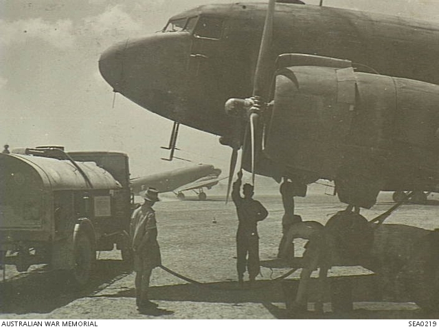 Akyab, Burma. c. 4 April 1945. On a dusty airstrip, a Douglas C47 ...