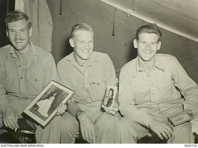 Akyab, Burma. c. 4 April 1945. Three RAAF members of No. 62 (Dakota ...