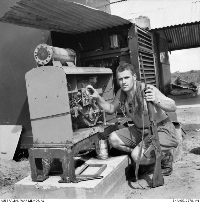 Bien Hoa, Vietnam. 1965-12. Bare-chested Gunner Barry Stillwell of ...