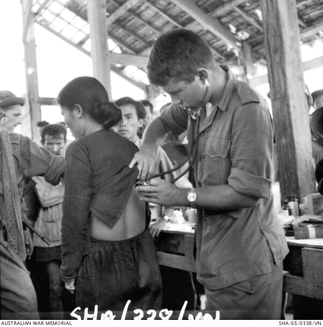 Binh Tuy Province, Vietnam. 1965-12. A Vietnamese woman is examined in ...