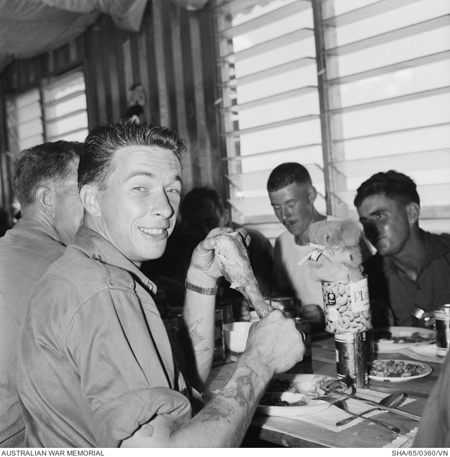 Private John Shortland of Holsworthy, NSW, enjoys eating a turkey leg ...