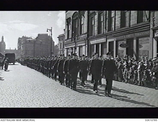 Dundee, Scotland. 1943-04-25. Led by the local police pipe band ...