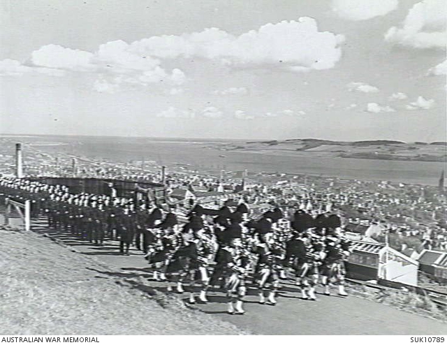 Dundee, Scotland. 1943-04-25. Led by the local police pipe band ...