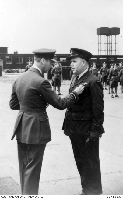 England. C. 1944-09. His Majesty King George VI pins the DFC on the ...