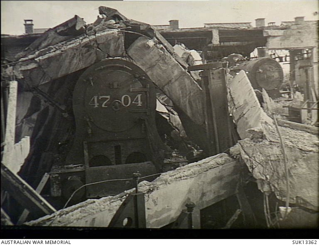 Hasselt, Belgium. 1944-05. A wrecked locomotive framed in the broken ...