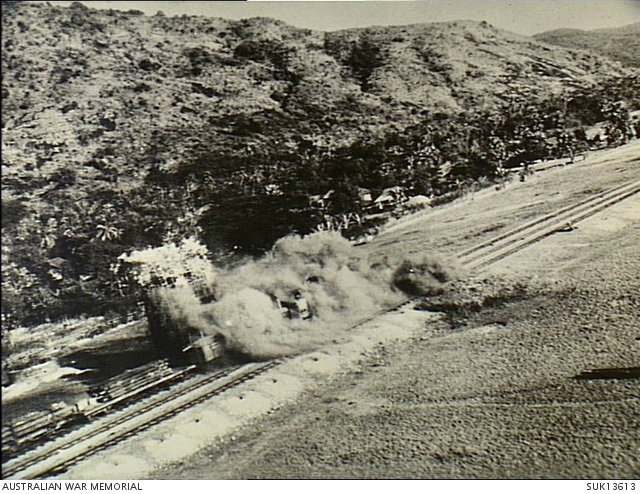 Zingyaik, Burma. C. 1945-01. Smoke and dust almost obscured this engine ...