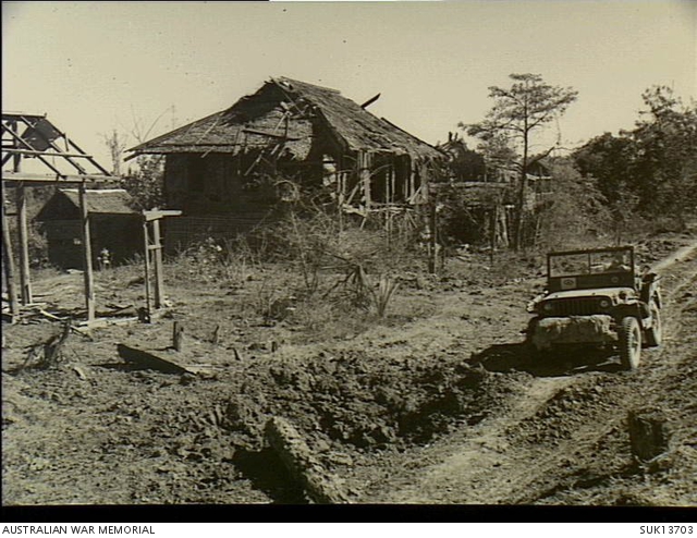 Ye-U, Burma. C. 1945-02. An RAF jeep bumping its way along a track in ...