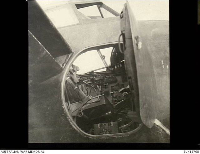 England. C. 1945-02. A view through the open door into the cockpit of ...