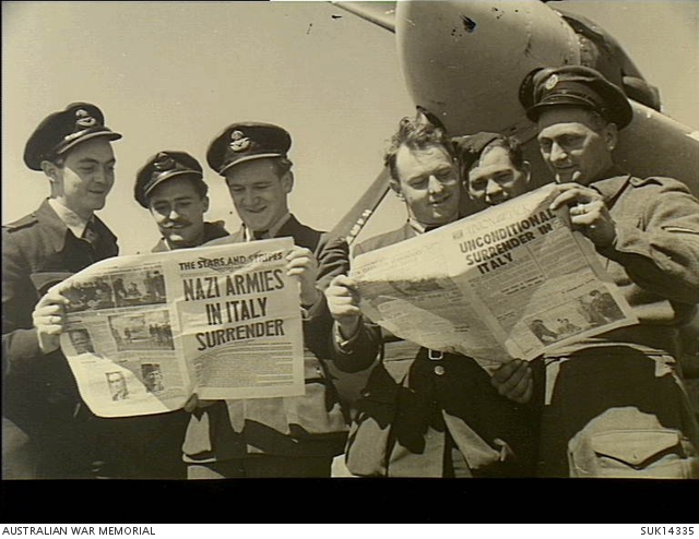Italy. C. 1945-05. Reading the news of the German collapse in Italy in ...