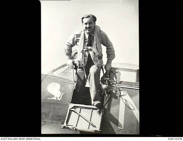 RAF Station Matlaske, England. C. 1945-05. Climbing out of the cockpit ...
