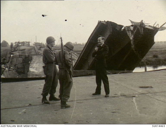 Germany. 1945-06-22. Flight Lieutenant John Hall DFC, RAAF, talking to ...