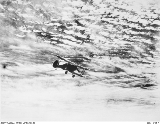 Over Bardia, Cyrenaica, North Africa. A Gloster Gladiator aircraft of ...