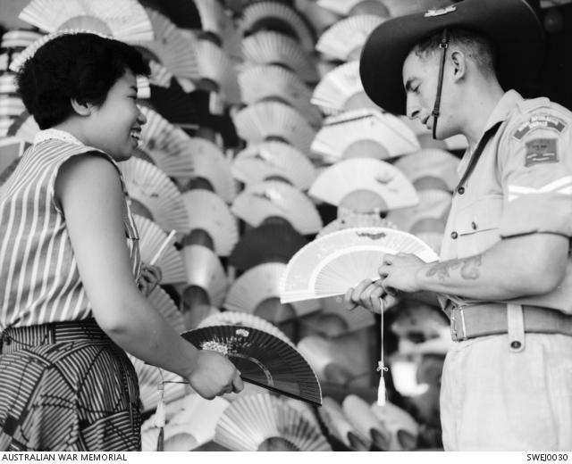 Shopping for souvenirs in Kure, Japan, is Corporal (Cpl) Nev Woods, of ...