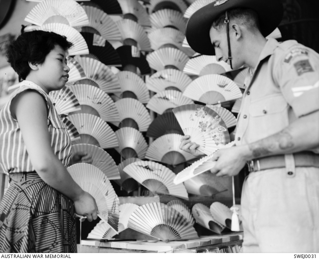 Shopping for souvenirs in Kure, Japan, is Corporal (Cpl) Nev Woods, of ...