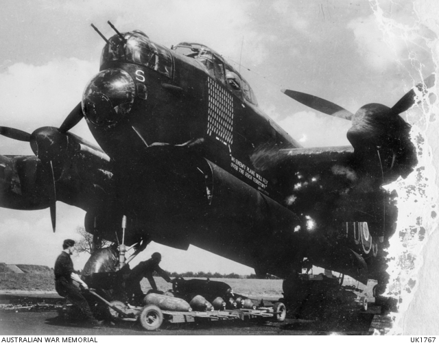 Ground crew loading bombs on to Lancaster bomber "S for Sugar", No 467 ...