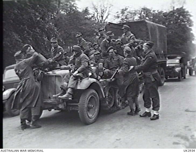 Germany. 1945-04-28. RAF service policeman with German troops who drive ...