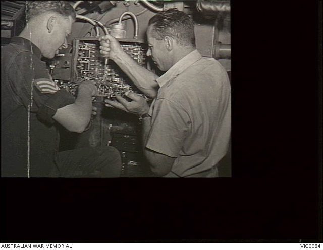 Two maintenance personnel working on equipment at No. 1 Flying Boat ...