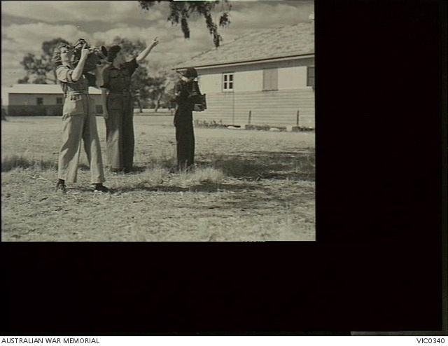 Point Cook, Vic. 1944-01-14. Three WAAAF photographers practicing with ...