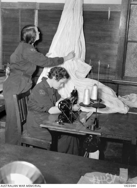 Point Cook, Vic. 1944-04-01. Two WAAAF fabric workers repairing a ...