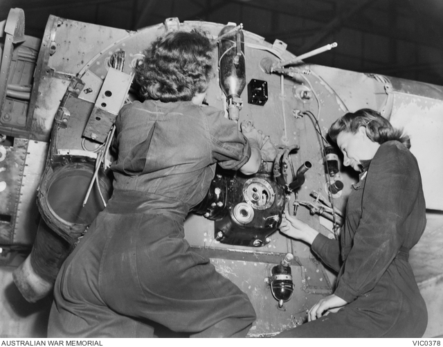 Tocumwal, NSW. C. 1944. Two WAAAF airframe fitters at work on an ...