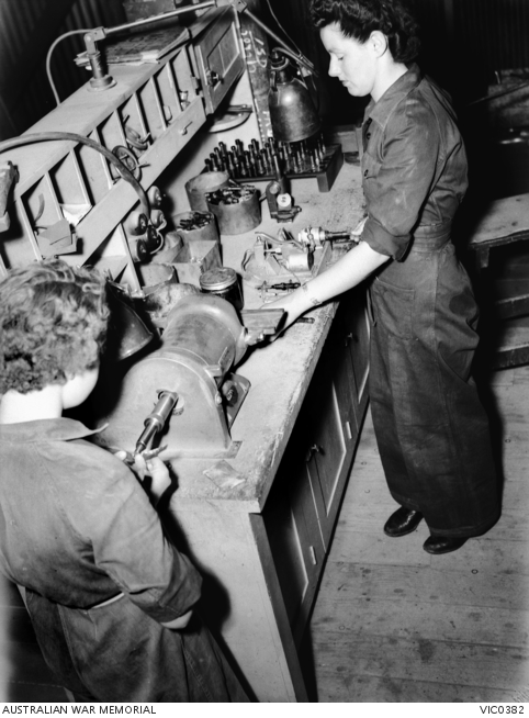 Tocumwal, NSW. C. 1944. Two WAAAF flight mechanics checking spark-plugs ...