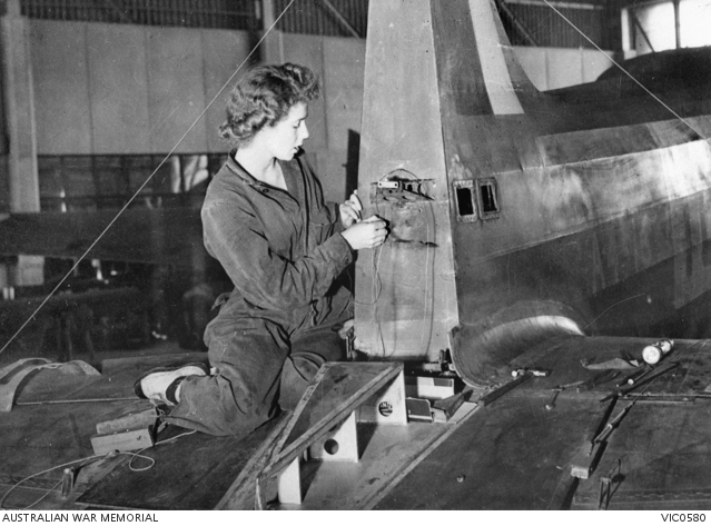 Geraldton, WA. C. 1943-12. This WAAAF Flight Rigger is effecting a ...