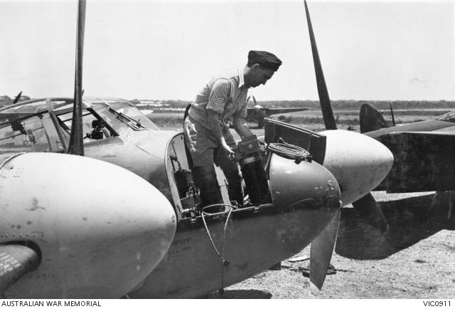 Laverton, Vic. C. 1945. A RAAF Sergeant Photographer fitting an aerial ...