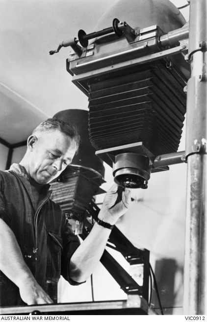 Laverton, Vic. C. 1945. A RAAF Sergeant Photographer using an enlarger ...