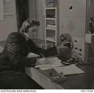 A WAAAF Sergeant Telegraphist operating a radio set to receive and ...