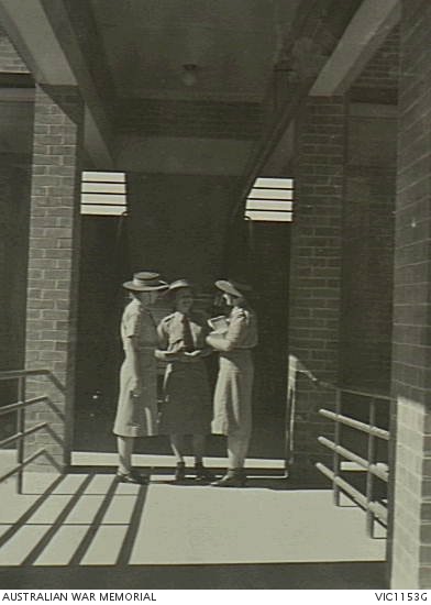 Melbourne, Vic. 1943-03-31. Three newly-enlisted WAAAF airwomen talk in ...