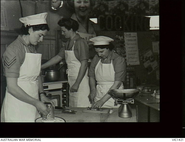 Melbourne, Vic. C. 1943. A WAAAF Corporal cook (left) and two WAAAF ...