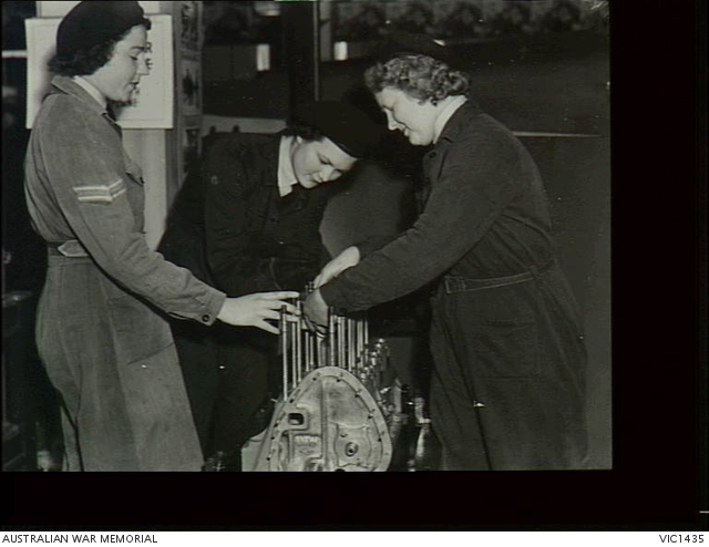 Melbourne, Vic. C. 1943. A WAAAF Corporal Flight Mechanic supervises ...