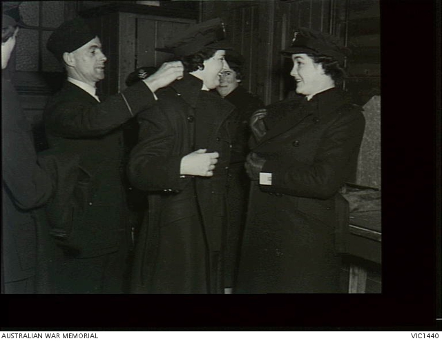 C. 1942. WAAAF Officers being fitted for greatcoats in the clothing ...